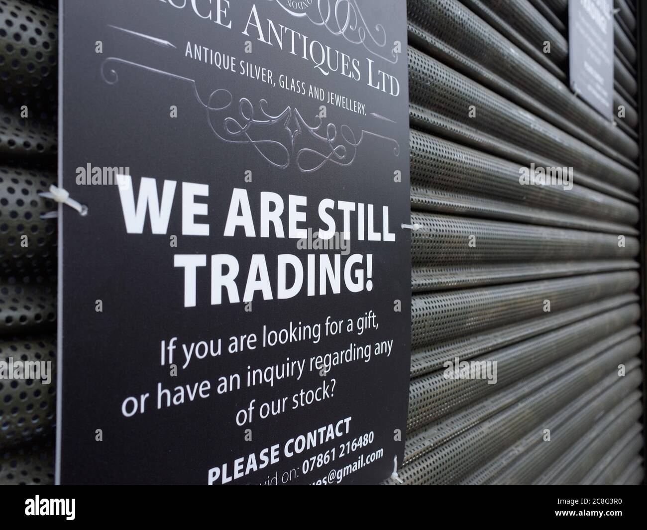 Shop sign saying 'we are still open' Many shops have altered opening ...