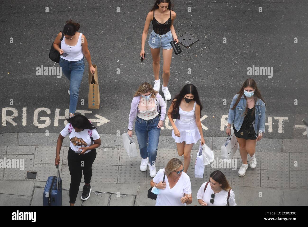 People wearing face masks on Oxford Street, London, as face coverings ...