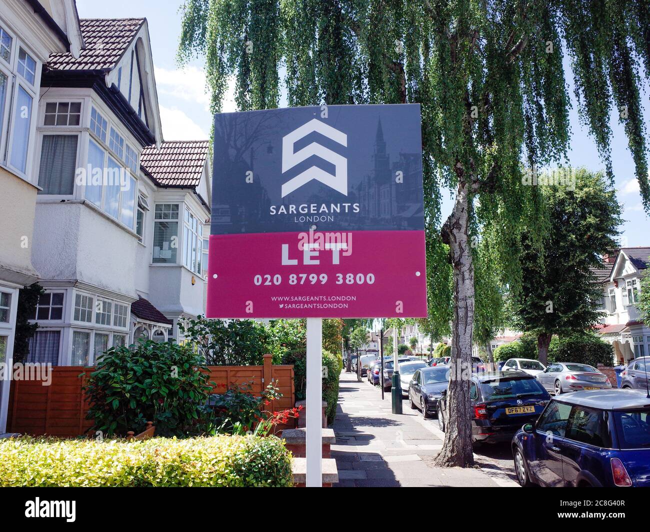 Estate Agent sign on street of houses in Ealing, West London Stock ...