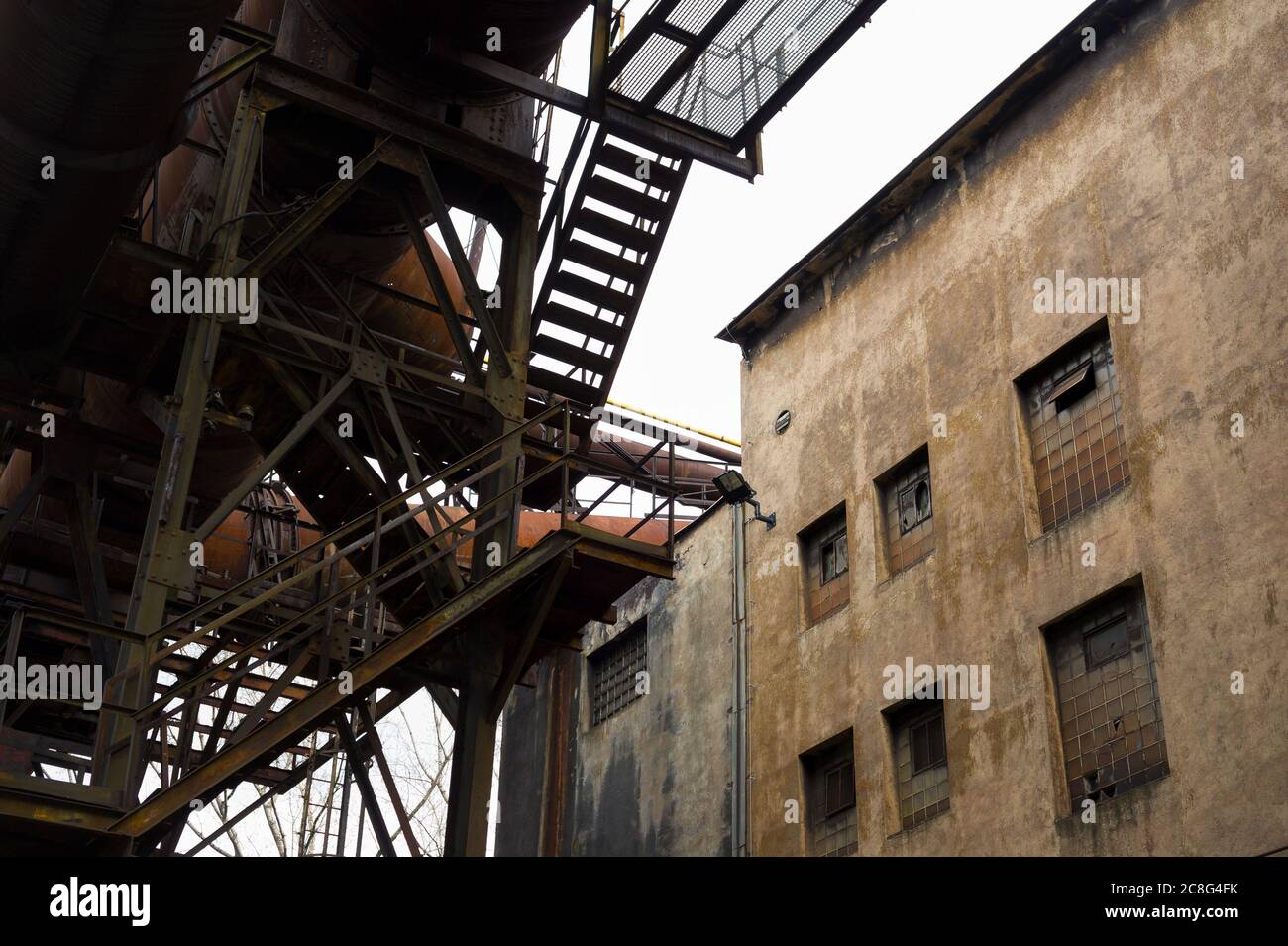 Detail of old abandoned factory - frontage of industrial building with ...