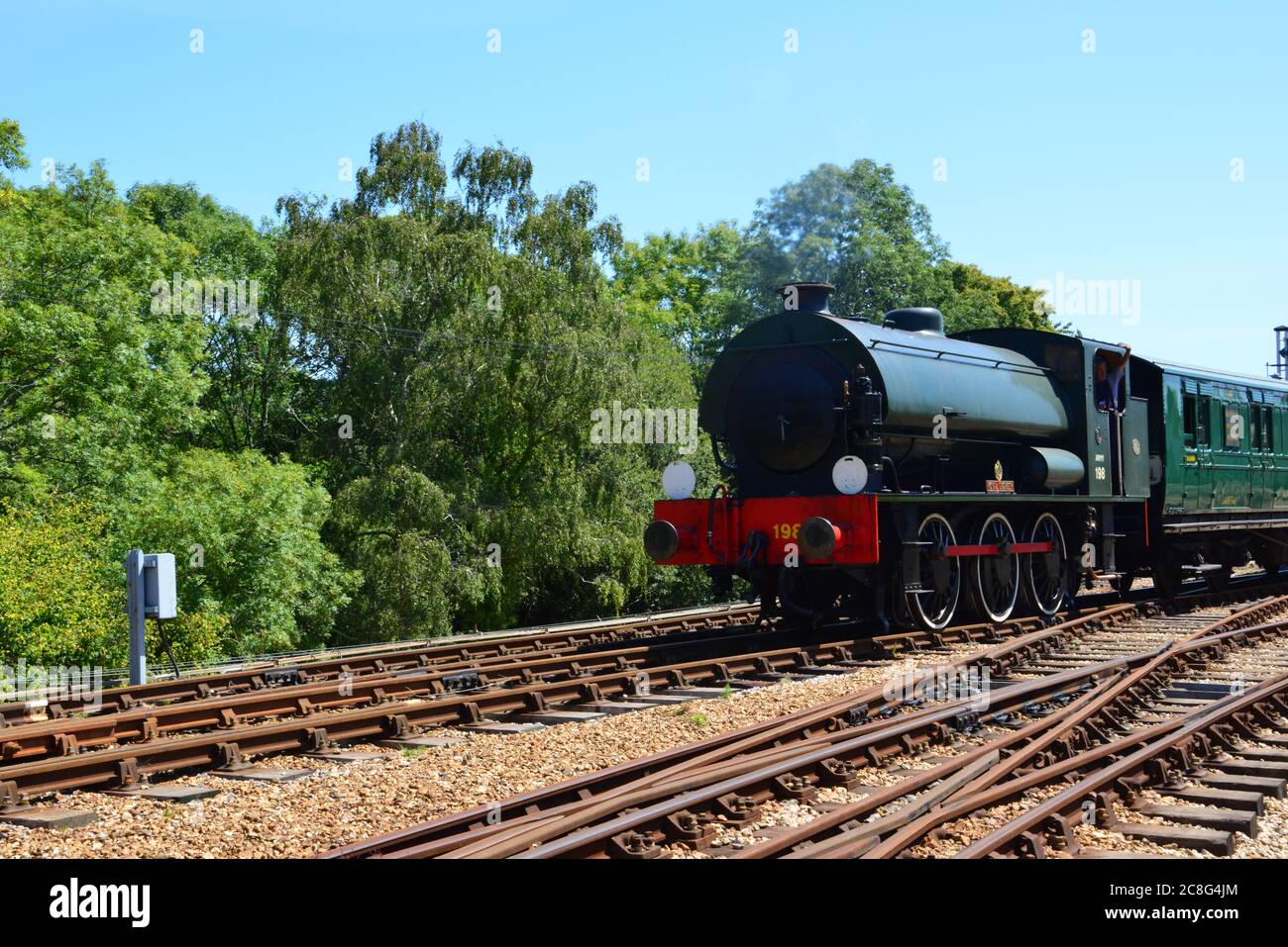 A Hunslet Austerity locomotive pulling a passenger train out of Haven ...