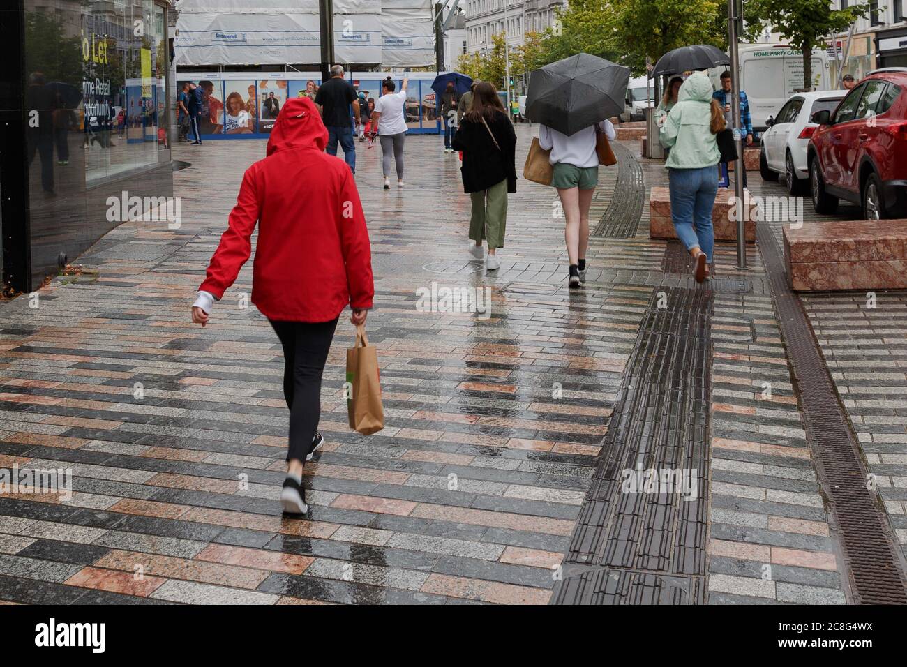Cork, Ireland. 24th July, 2020. Shoppers Brave Rain in Cork City ...