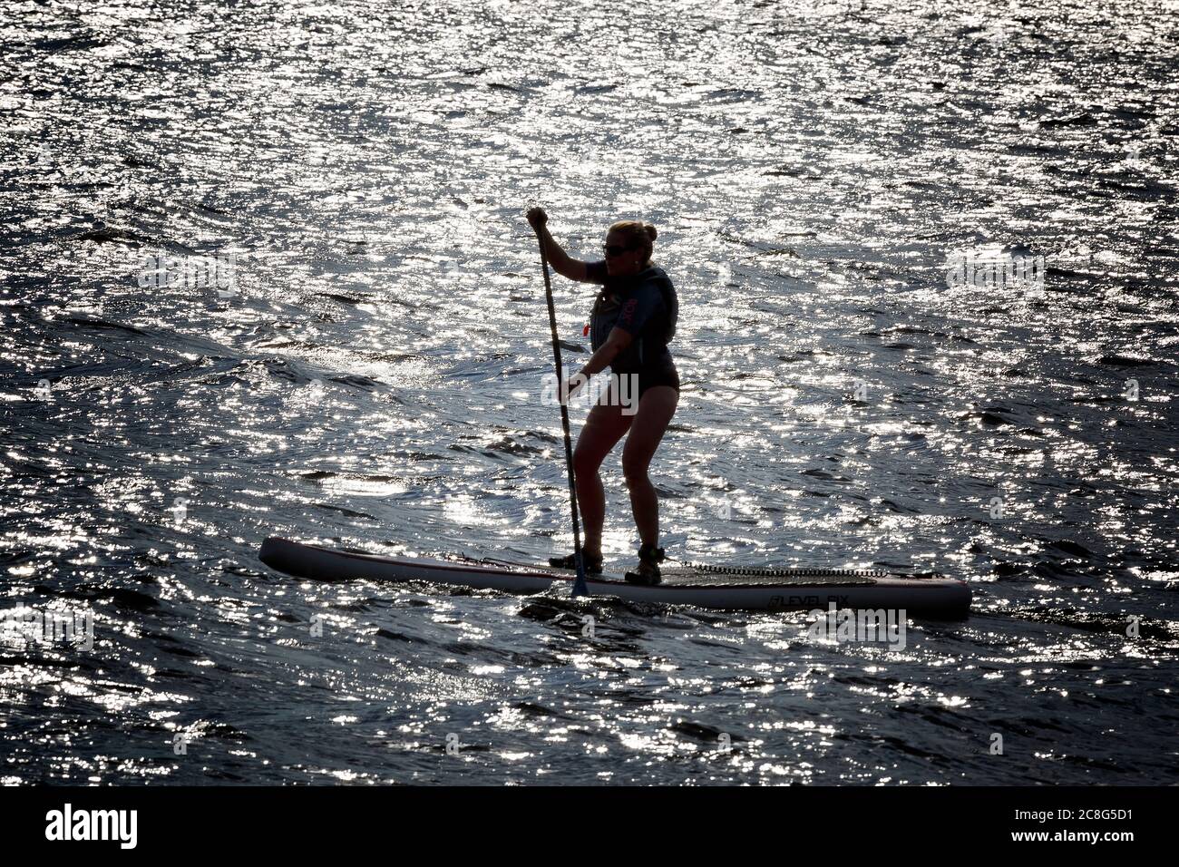 Woman silhouette on sup hi-res stock photography and images - Alamy