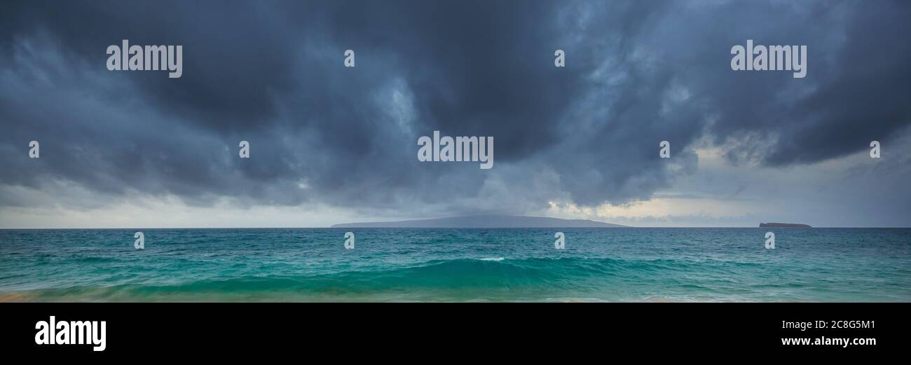 Amazing hawaiian beach. Wave in ocean at sunset or sunrise with surfer ...