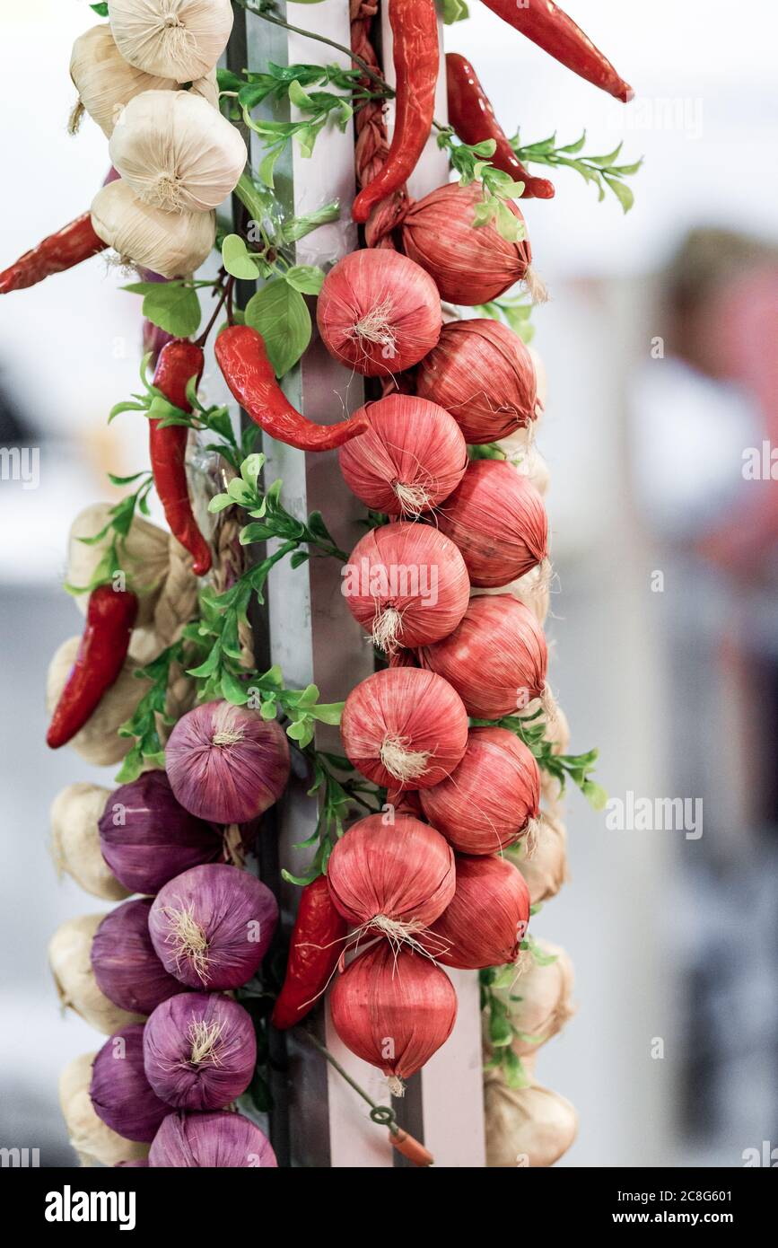 Bunch of red and beige traditional german handcrafted plats of onions ...