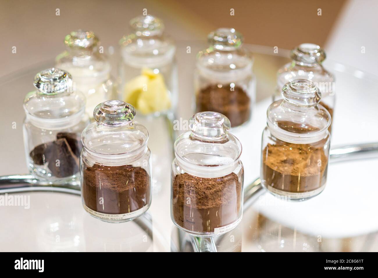 Regular and alkalised cocoa powder on with dar chocolate, in glass jars ...