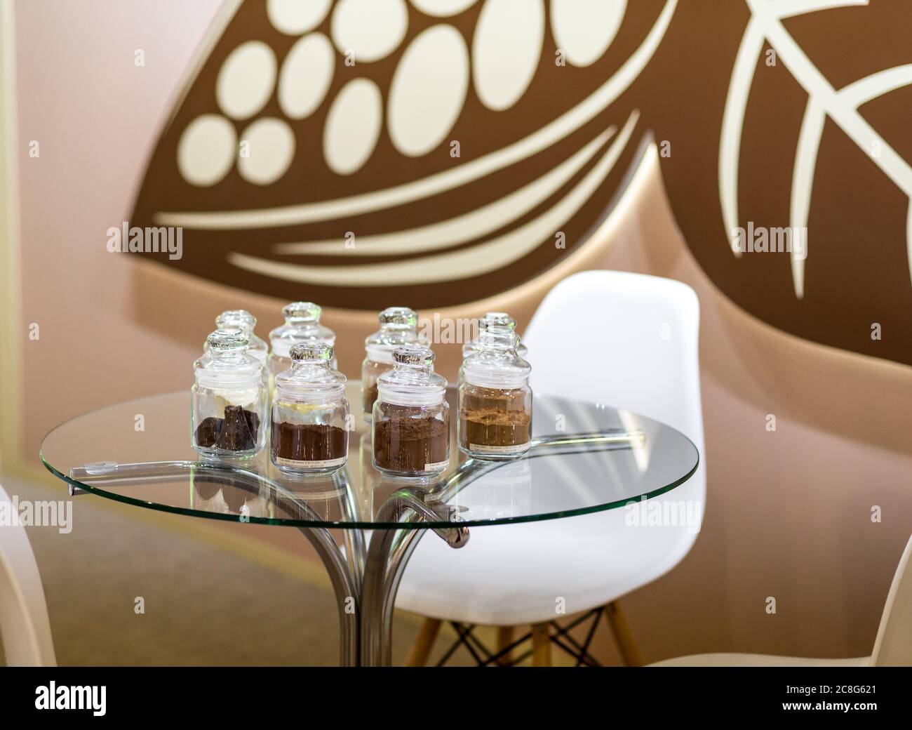 Regular and alkalised cocoa powder on with dar chocolate, in glass jars ...