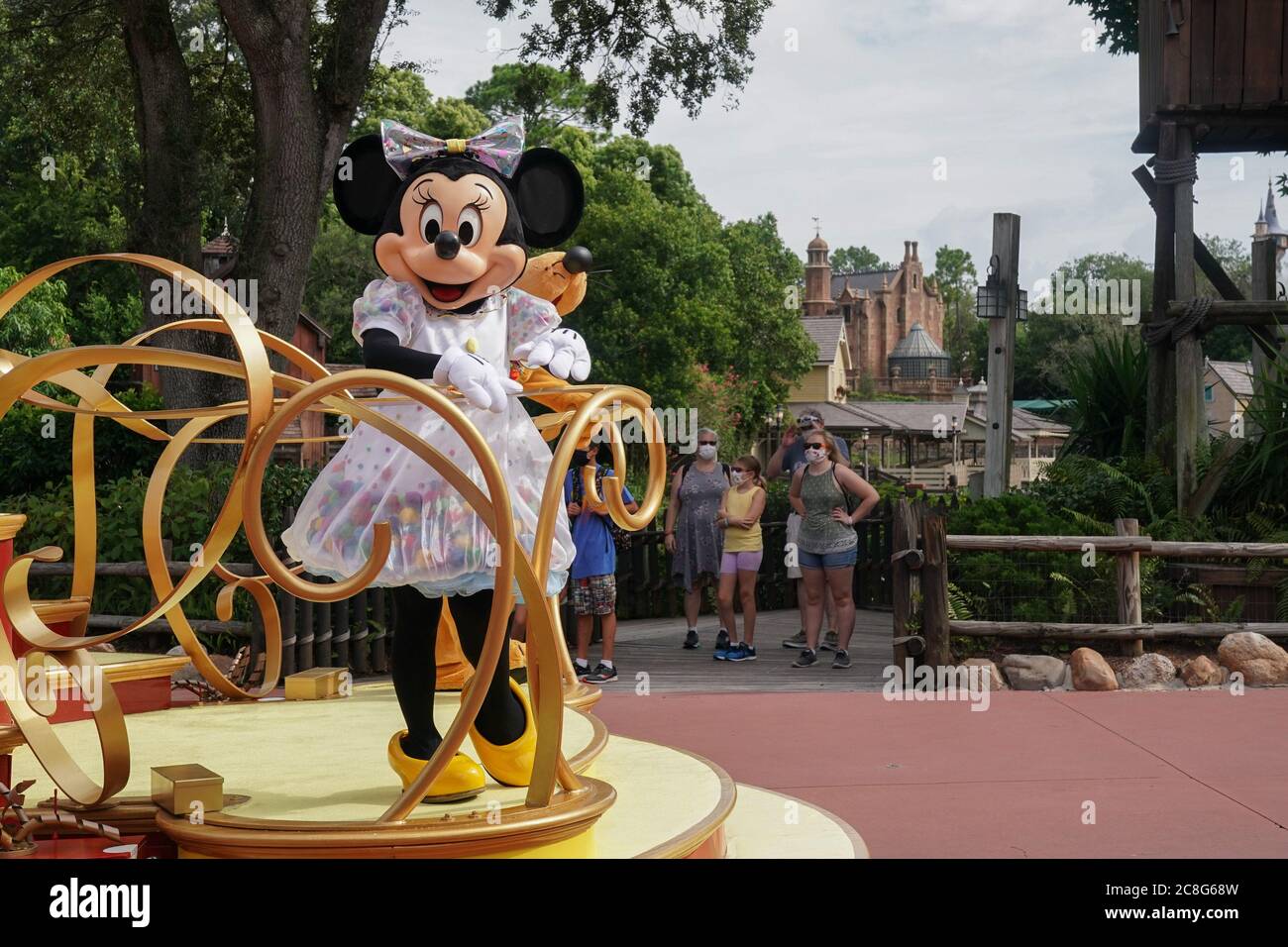 Orlando, FLA, USA. 23rd July, 2020. Minnie Mouse waves from a float ...