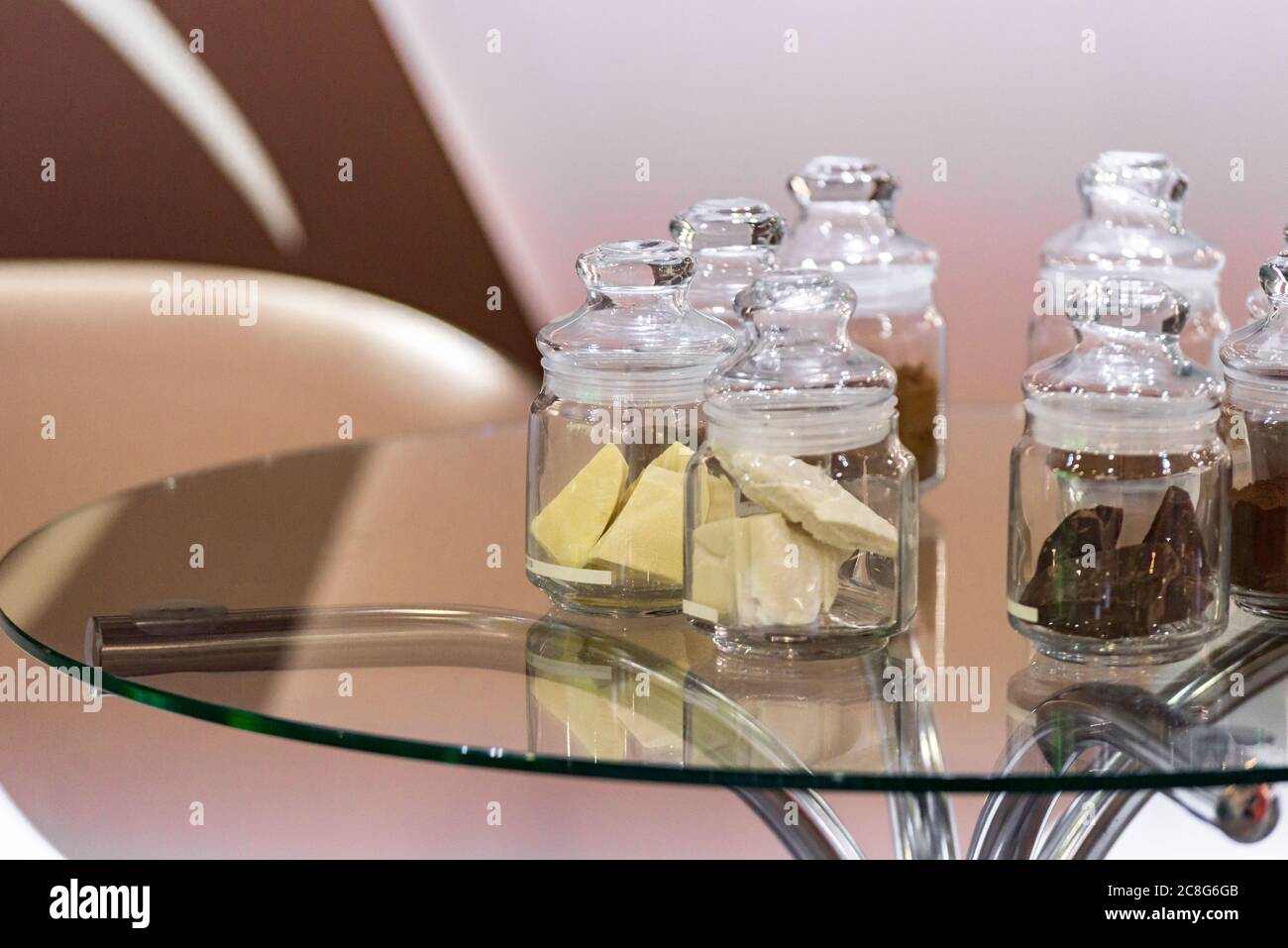 Regular and alkalised cocoa powder on with dar chocolate, in glass jars ...