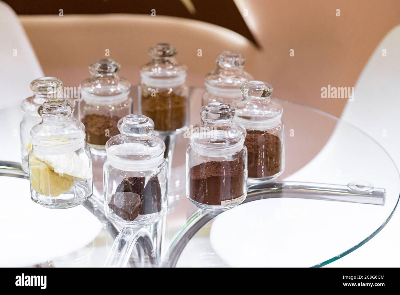 Regular and alkalised cocoa powder on with dar chocolate, in glass jars ...