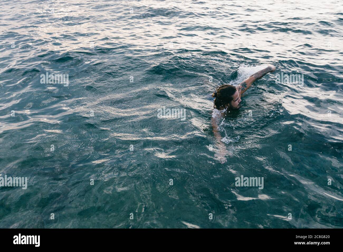 Man swimming in sea Stock Photo - Alamy
