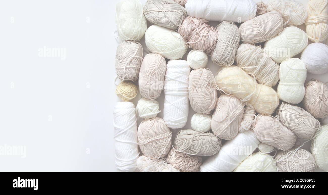 White, light, neutral yarn for knitting. Top view Stock Photo - Alamy