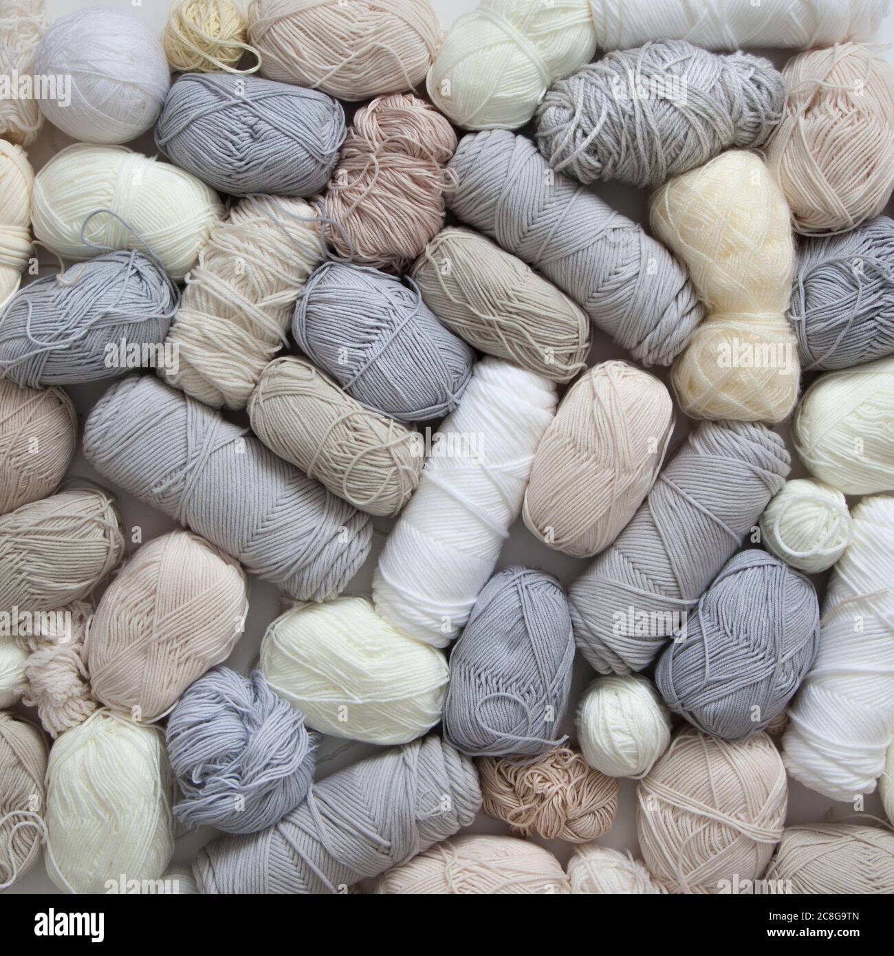 White, light, neutral and grey yarn for knitting. Top view Stock Photo ...