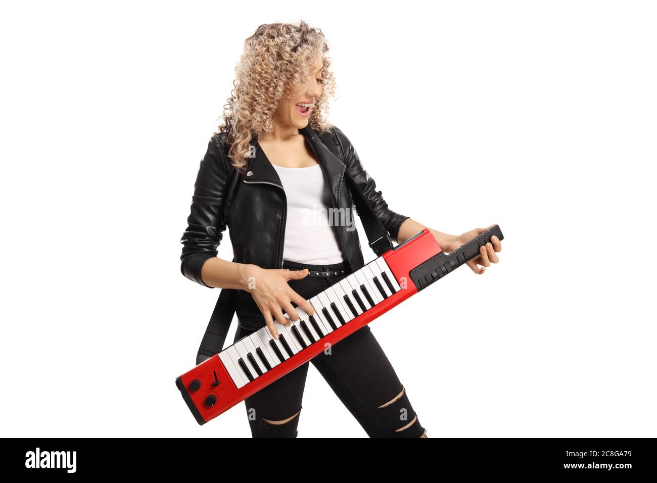 Woman playing a red keytar synthesizer isolated on white background ...