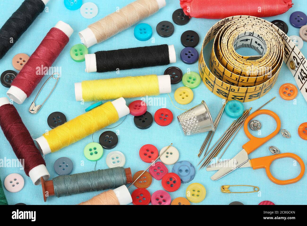 set of sewing items on blue fabric Stock Photo - Alamy