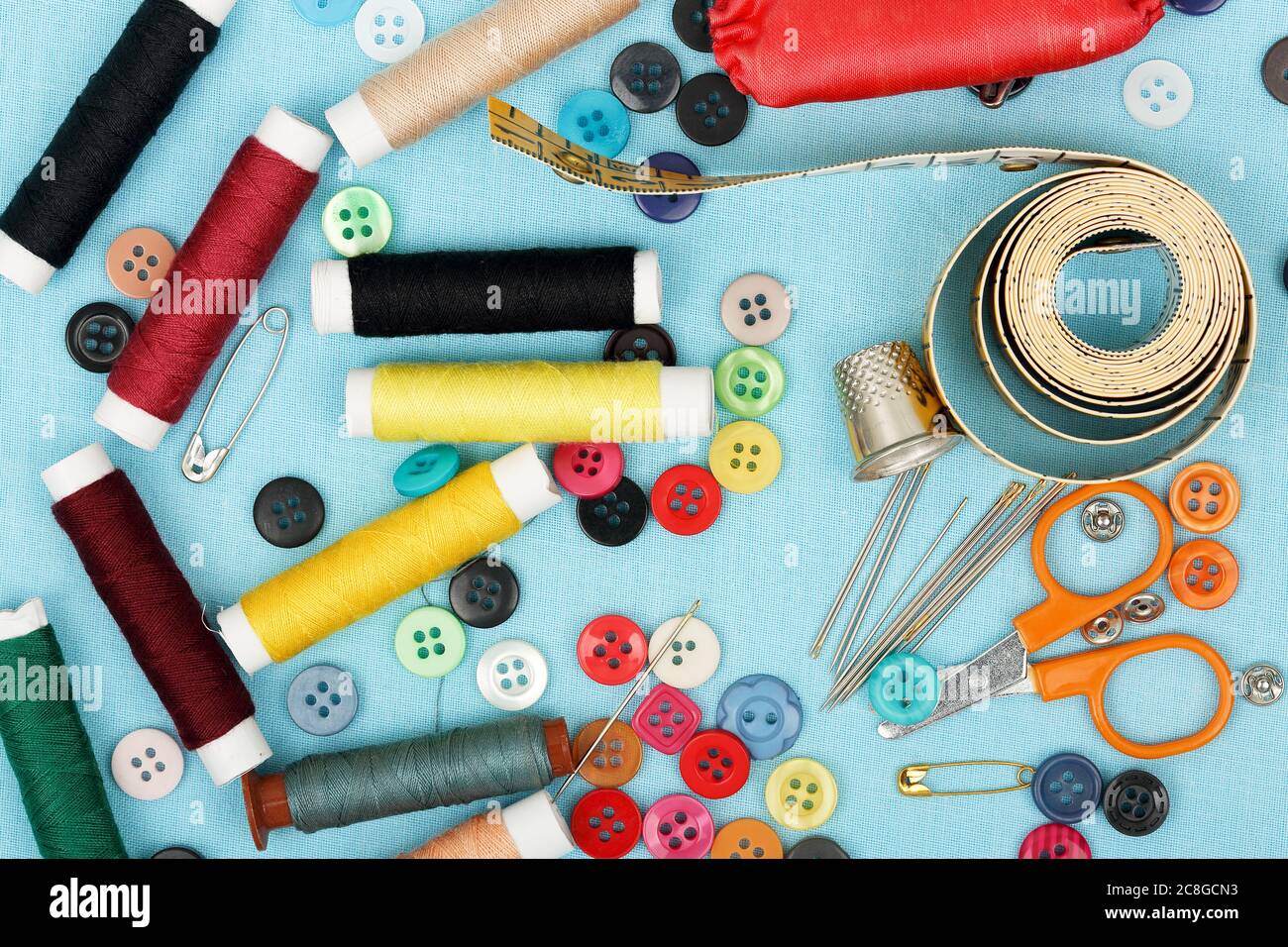 set of sewing items on blue fabric Stock Photo - Alamy
