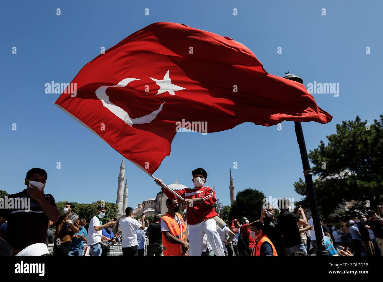 Mosque man holds turkish flag hi-res stock photography and images - Alamy