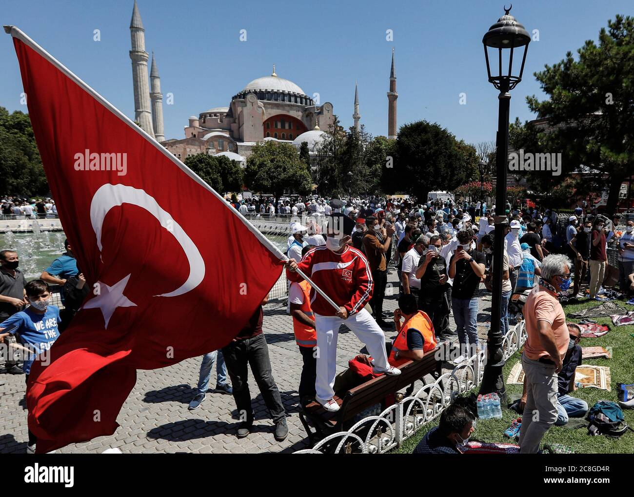 Istanbul, Turkey. 24th July, 2020. A man holds Turkish flag while ...