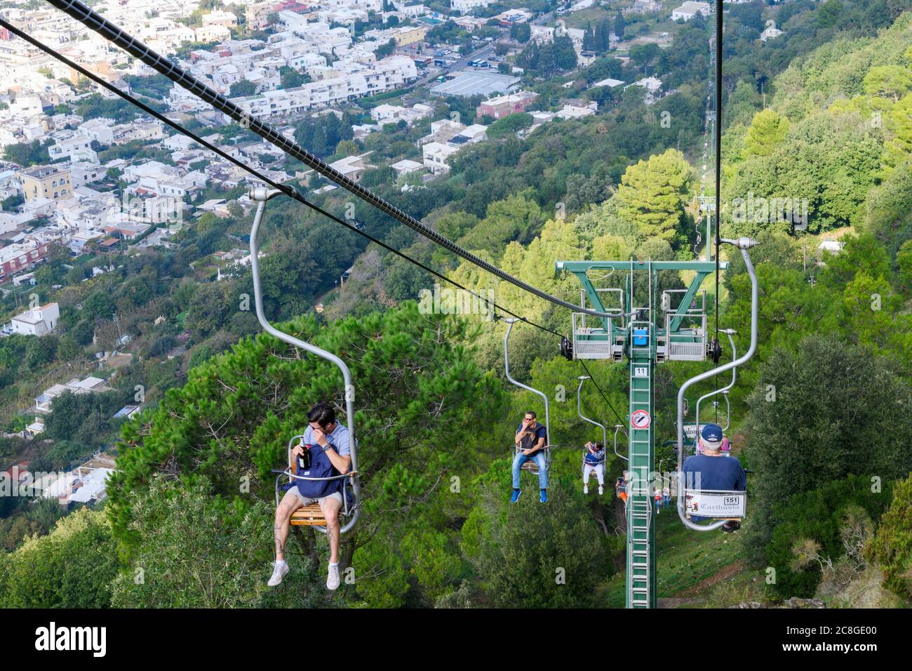 People use chairlifts to get to the summit of Monte Solaro which is the ...
