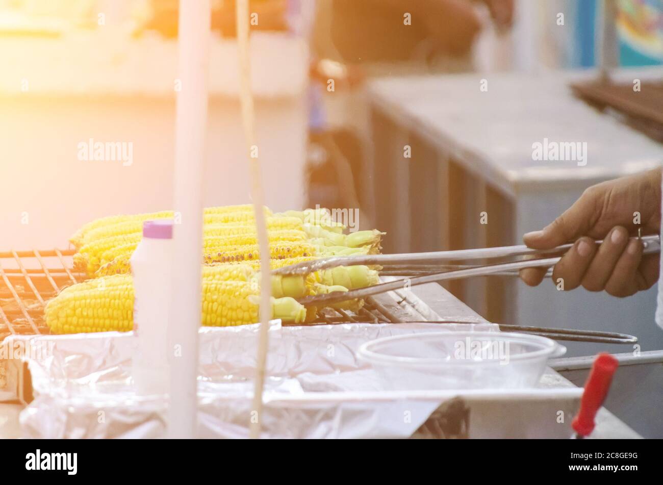 Grilled corn hand hi-res stock photography and images - Alamy