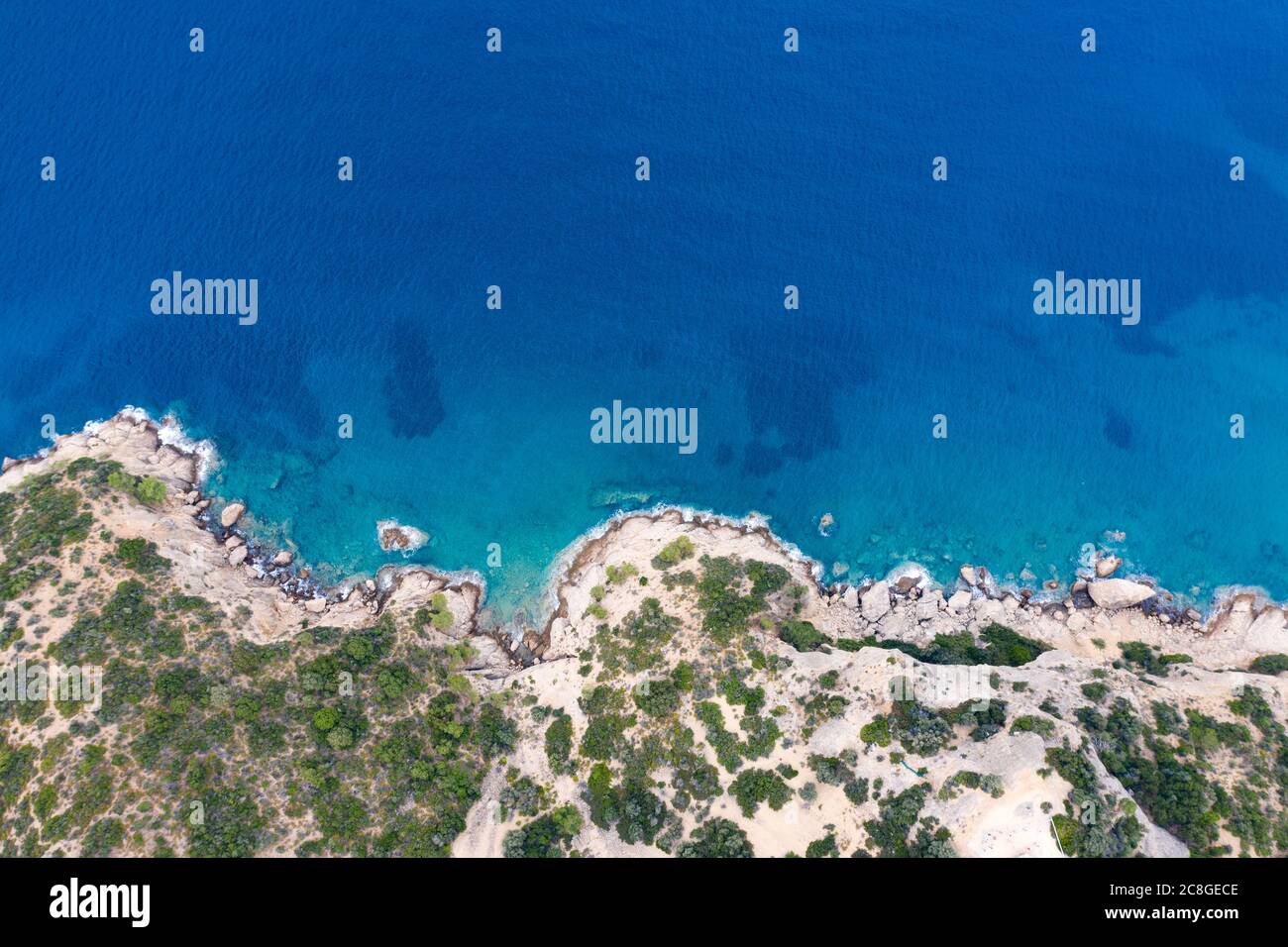 Aerial view of waves, rocks and transparent sea in Greece. Abstract ...