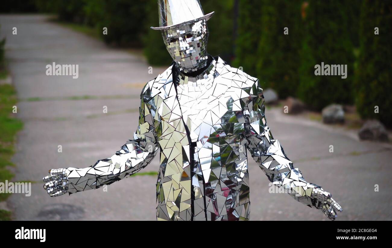 Male actor wearing unusual mirror costume frozes like a statue on ...