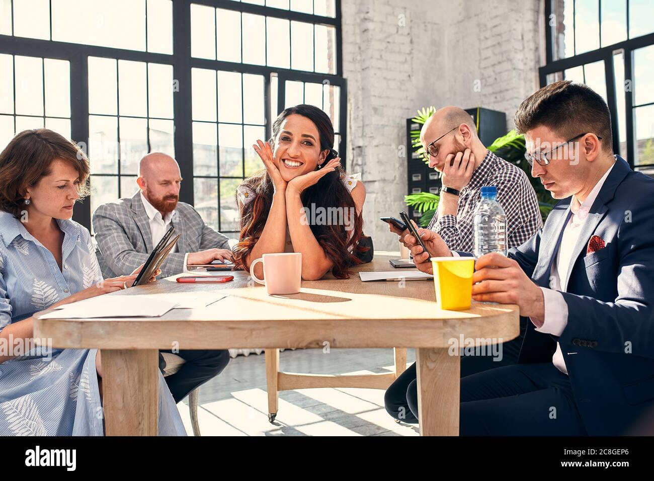 Work team trying to solve a difficult task Stock Photo - Alamy
