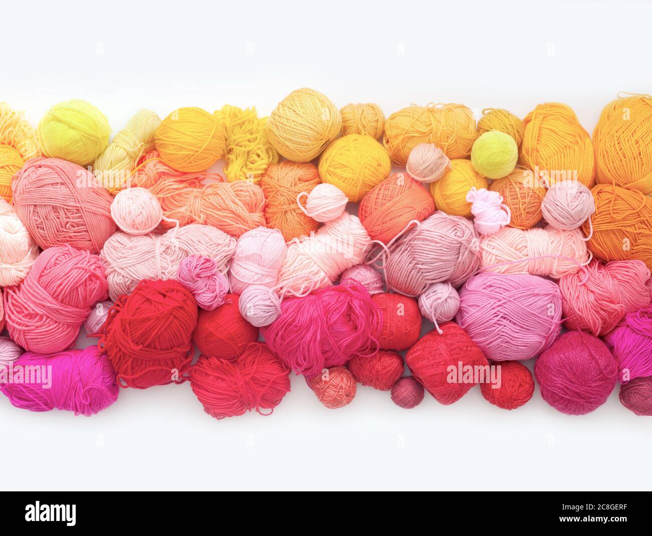 Colored balls and skiens of yarn for knitting. Top view. Rainbow colors ...