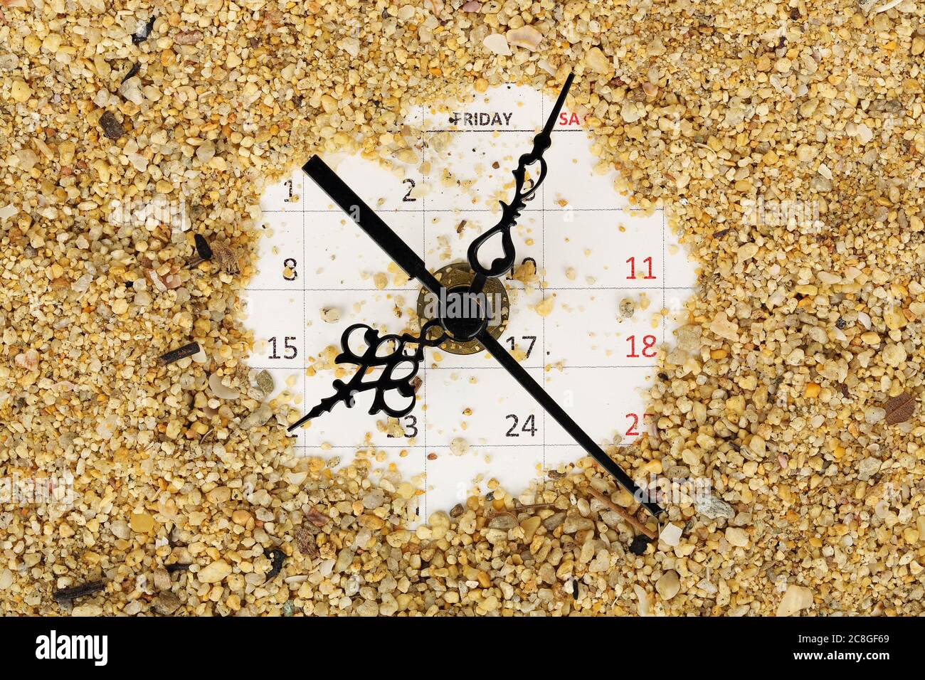 clock hands over calendar buried in sand Stock Photo - Alamy