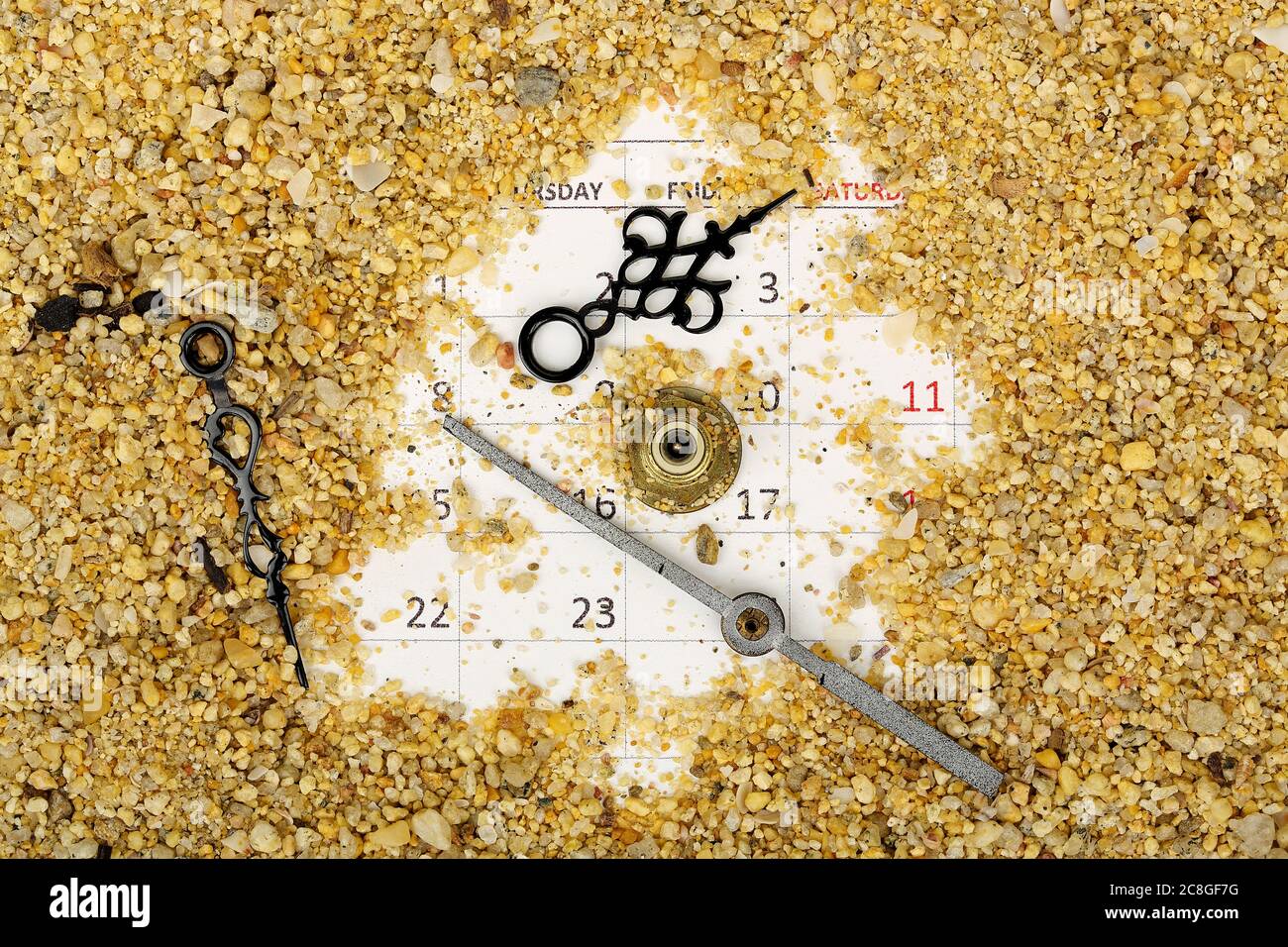 broken clock over calendar buried in sand Stock Photo - Alamy