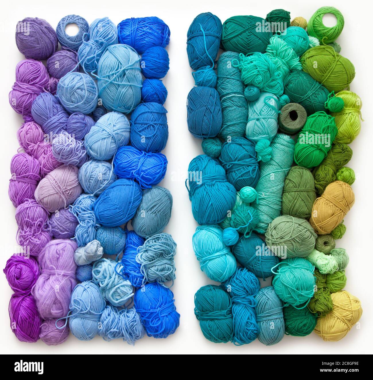 Colored balls and skiens of yarn for knitting. Top view. Rainbow colors ...