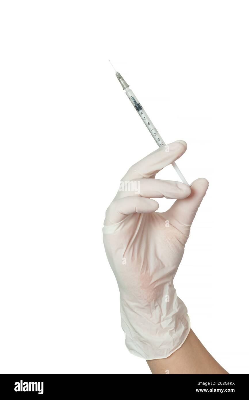 Syringe in a hand of the doctor or nurse. Hands in medical gloves ...