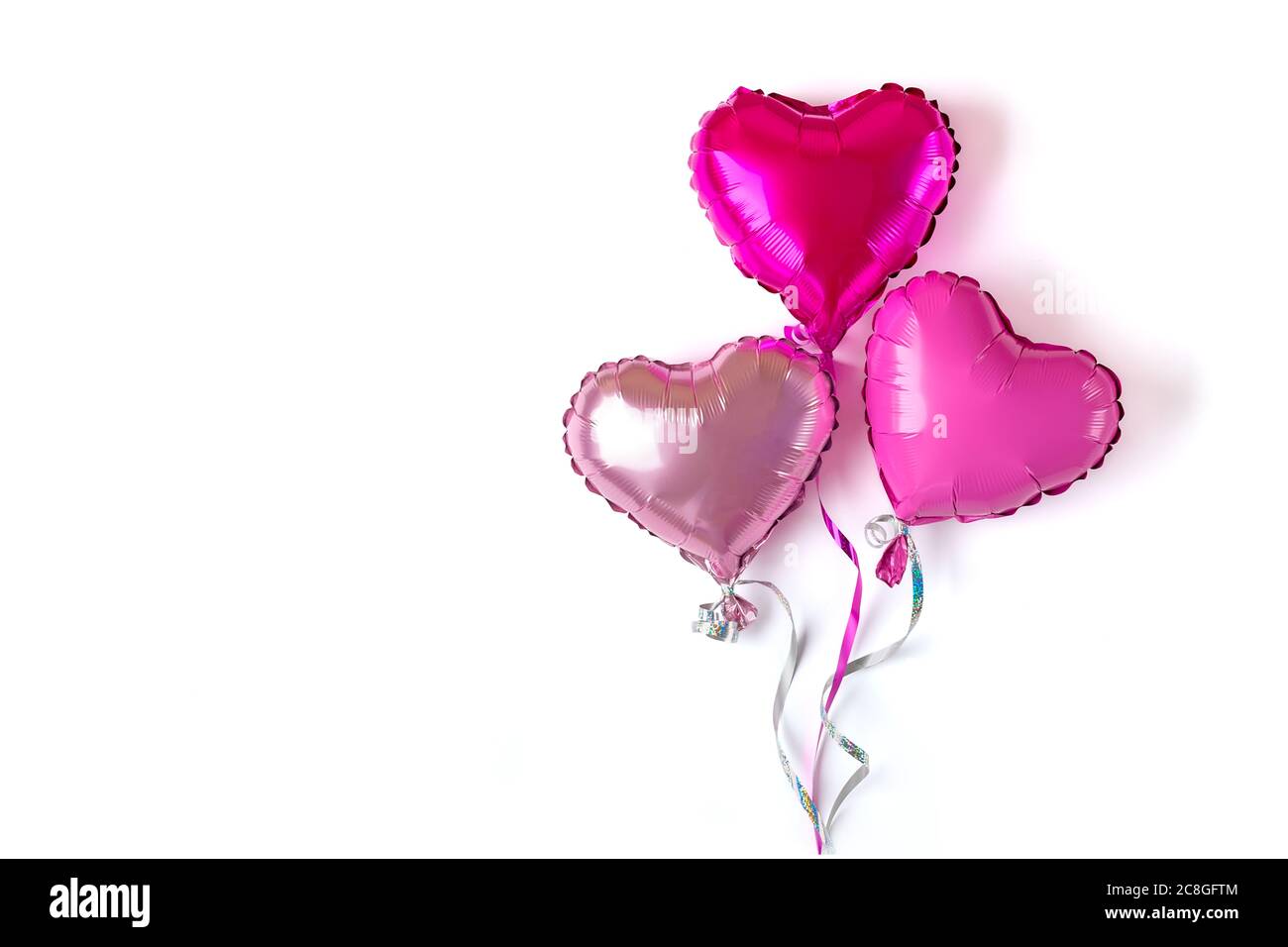 set of three inflatable heart in red, purple, matte pink color isolated ...