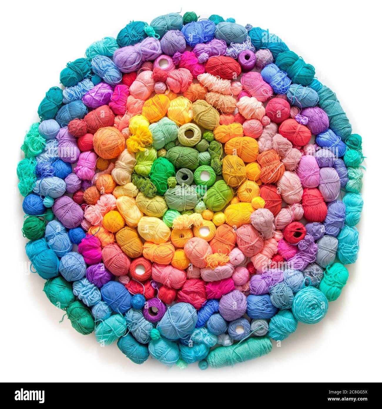 Colored balls and skiens of yarn for knitting. Top view. Rainbow colors ...