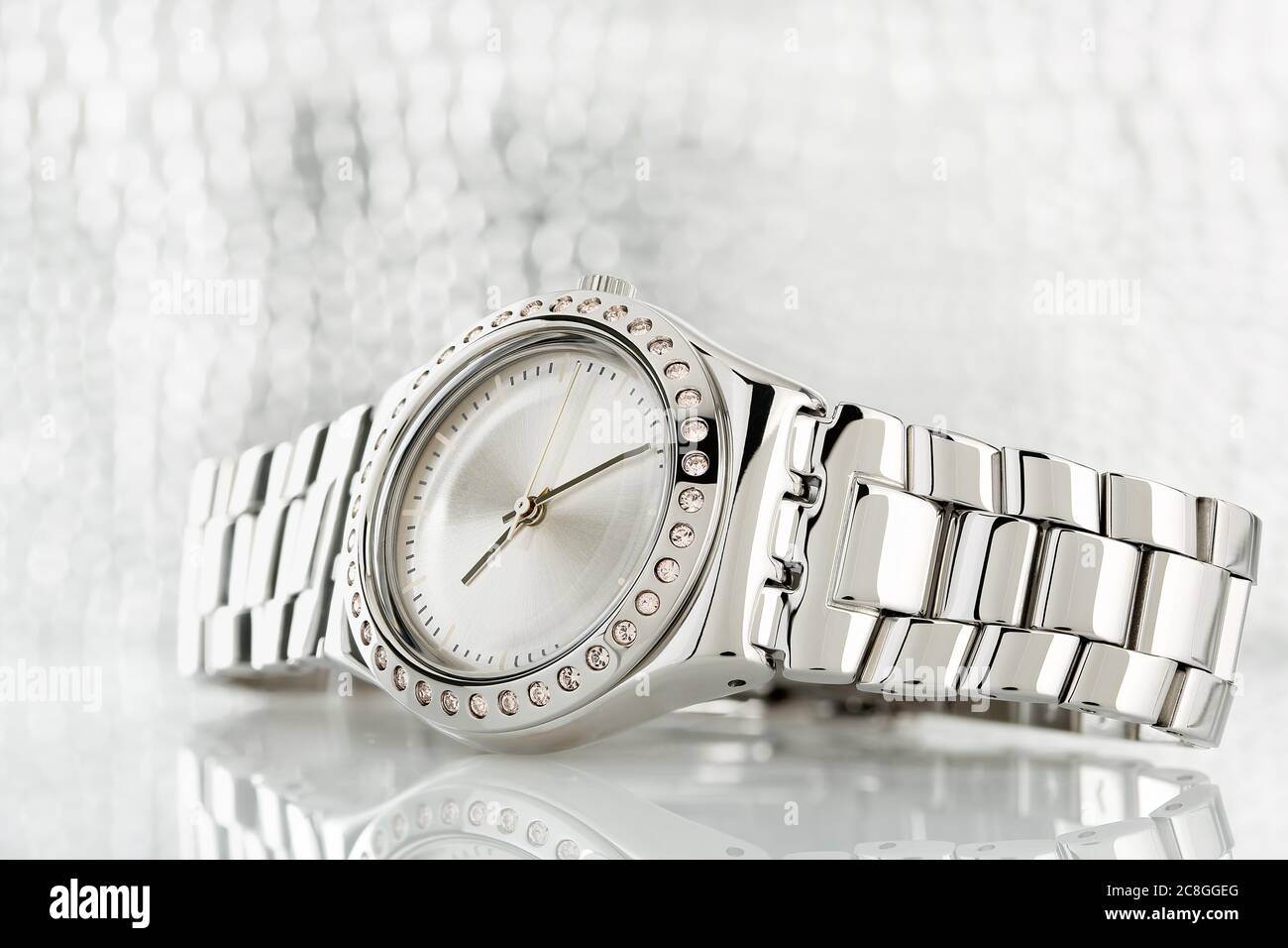 closeup of luxurious chrome watch against blurry background Stock Photo ...