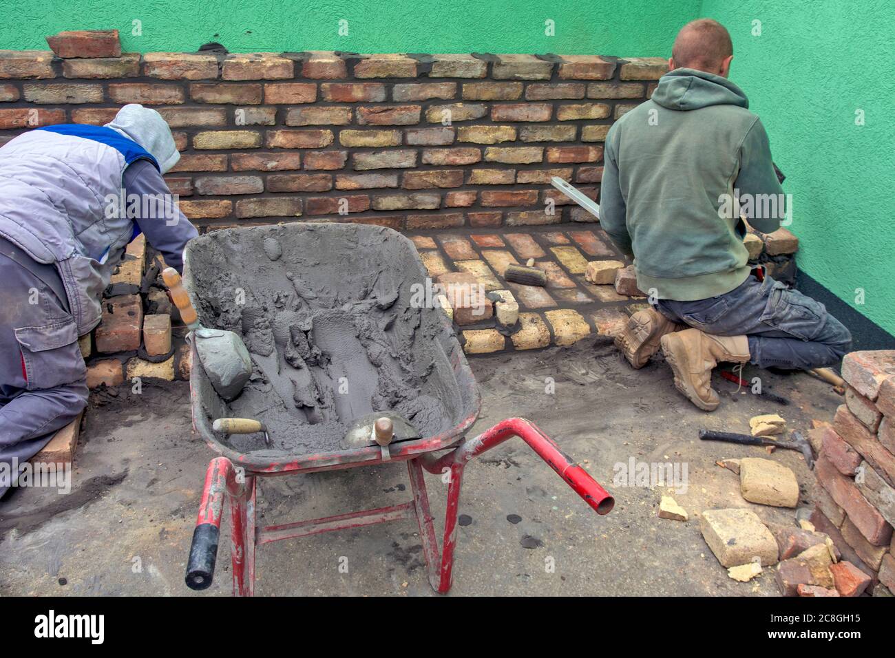Parked trolley, mortar and tools to help build the building. Several of ...