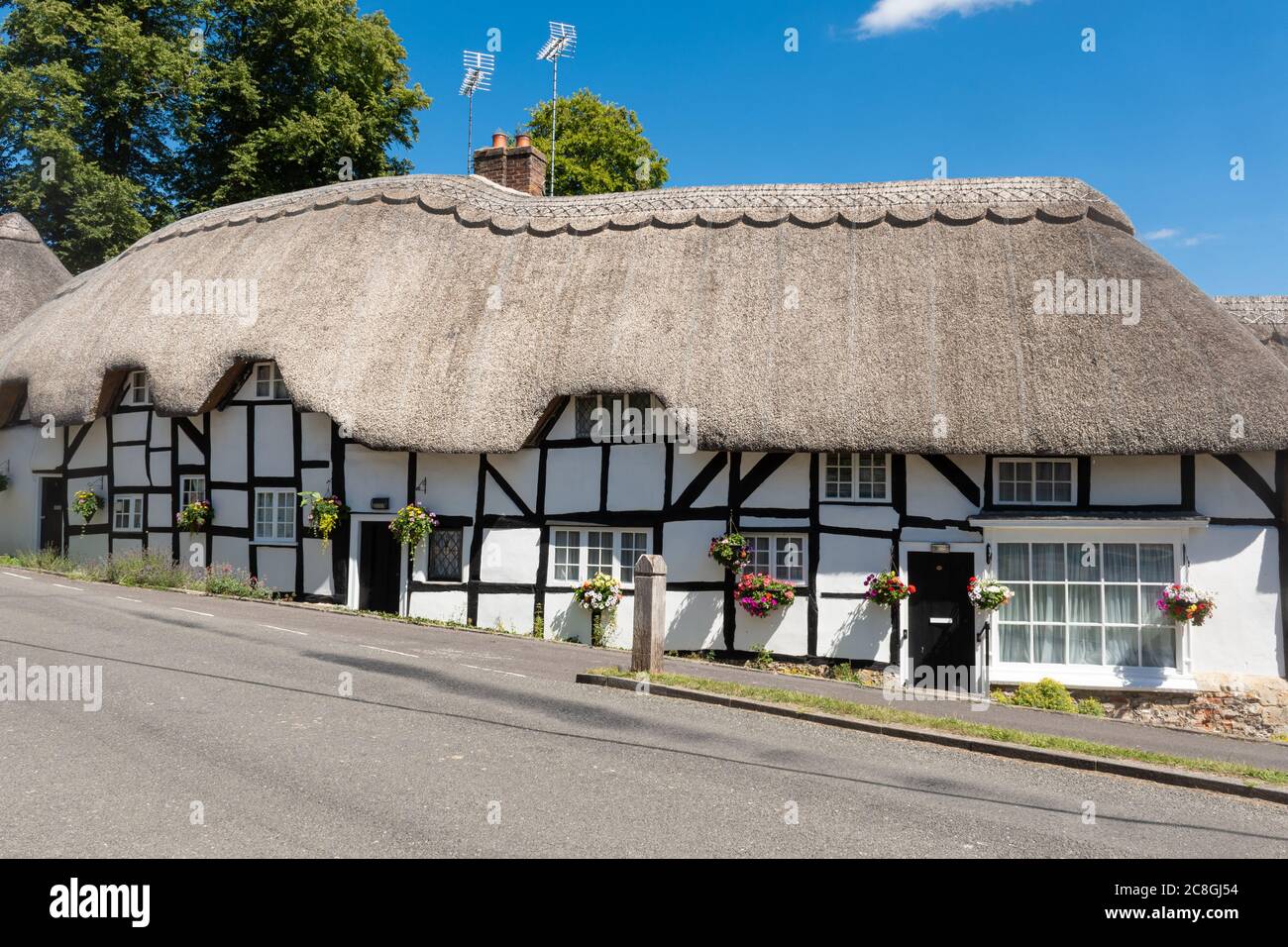 Pretty thatched cottages in the Hampshire village of Wherwell, England ...