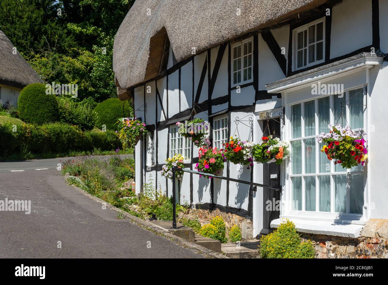 Pretty thatched cottages in the Hampshire village of Wherwell, England ...