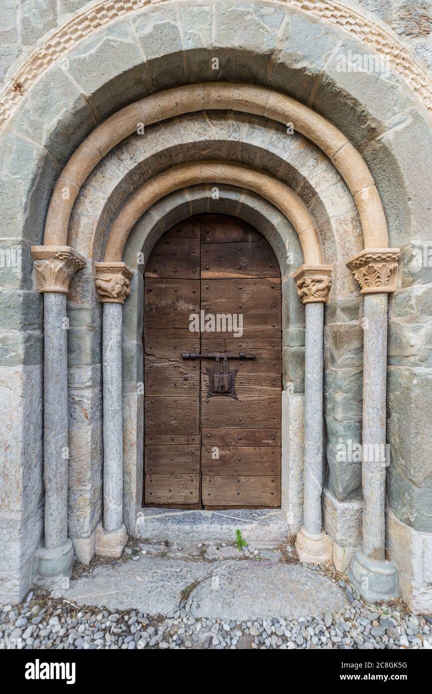 Main door and bolt of romanesque Assumption church in Coll decl Stock ...
