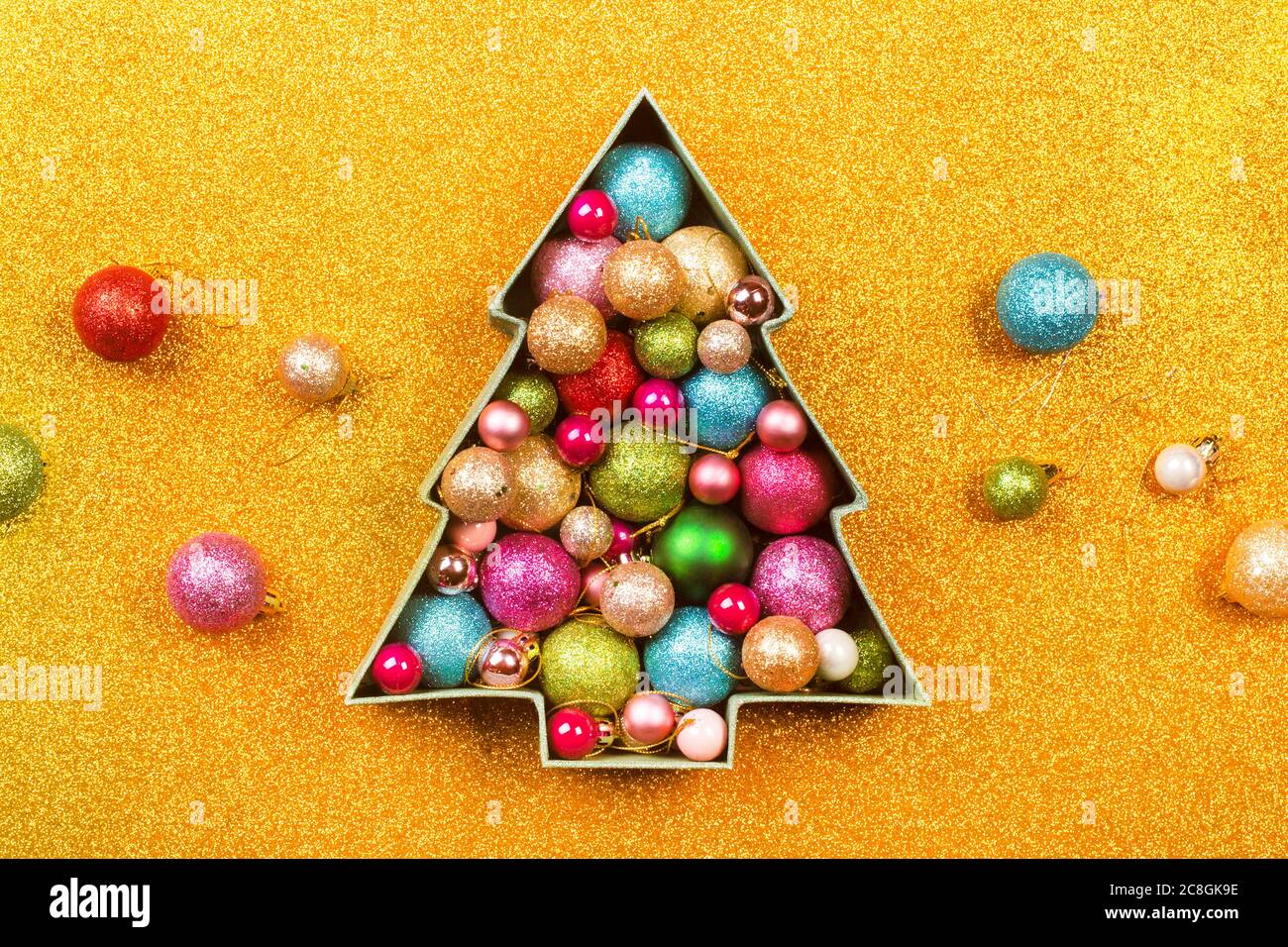 christmas tree shaped box with ornaments Stock Photo - Alamy