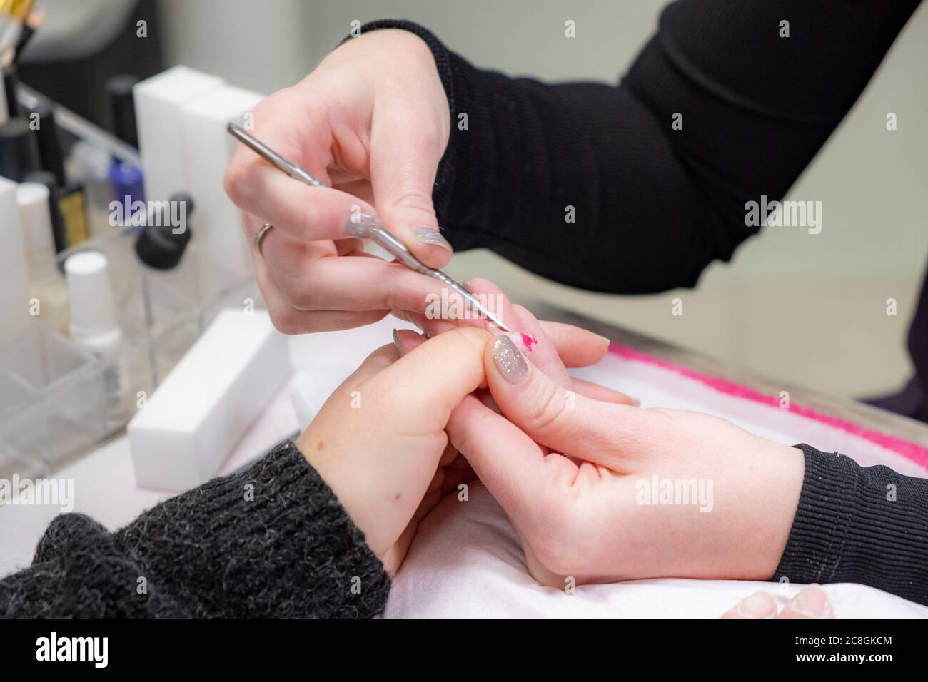 Nails getting painted by beautician Stock Photo - Alamy