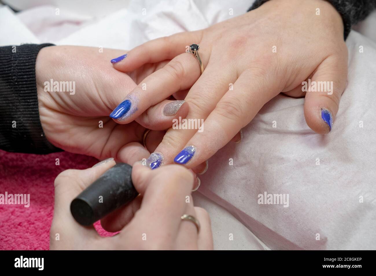 Nails getting painted by beautician Stock Photo - Alamy
