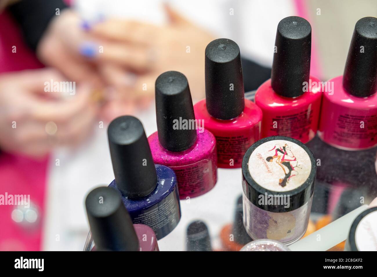 Nails getting painted by beautician Stock Photo - Alamy