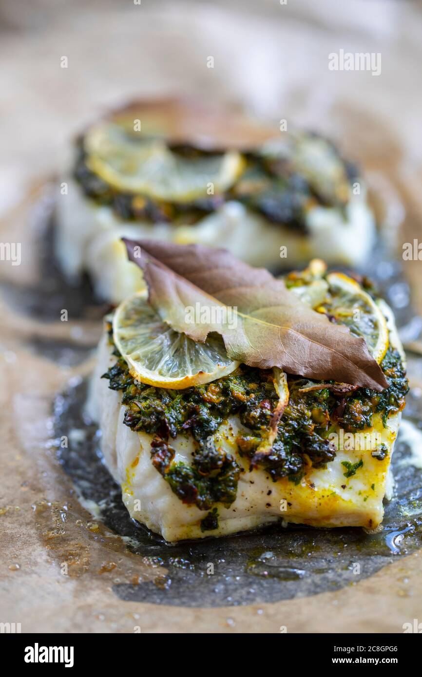 Cod fillets with coriander crust, lemon and bay leaf Stock Photo - Alamy