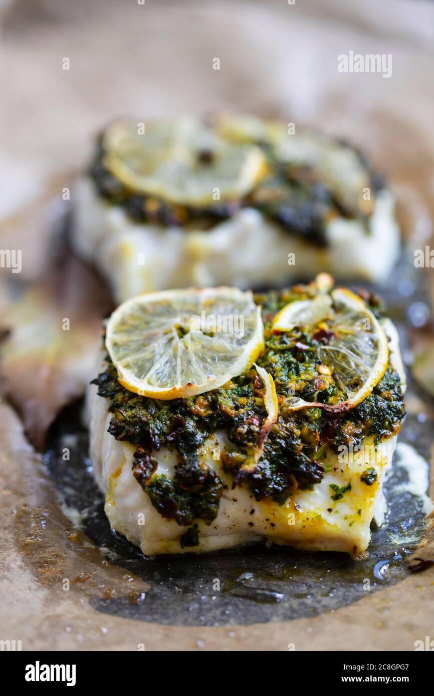 Cod fillets with coriander crust, lemon and bay leaf Stock Photo - Alamy