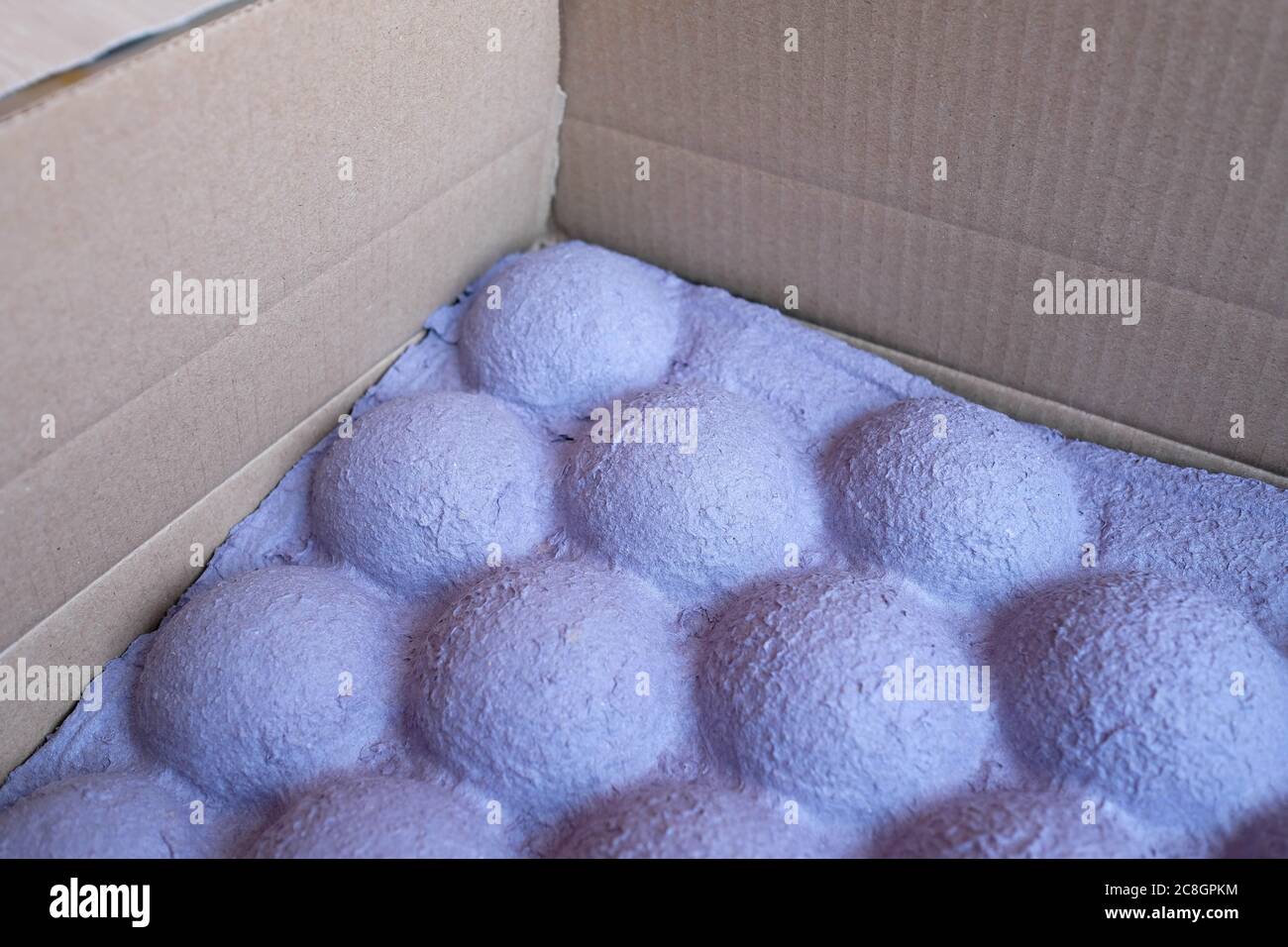 Unusual paper spacer for fixing goods. Purple packaging for the safety ...