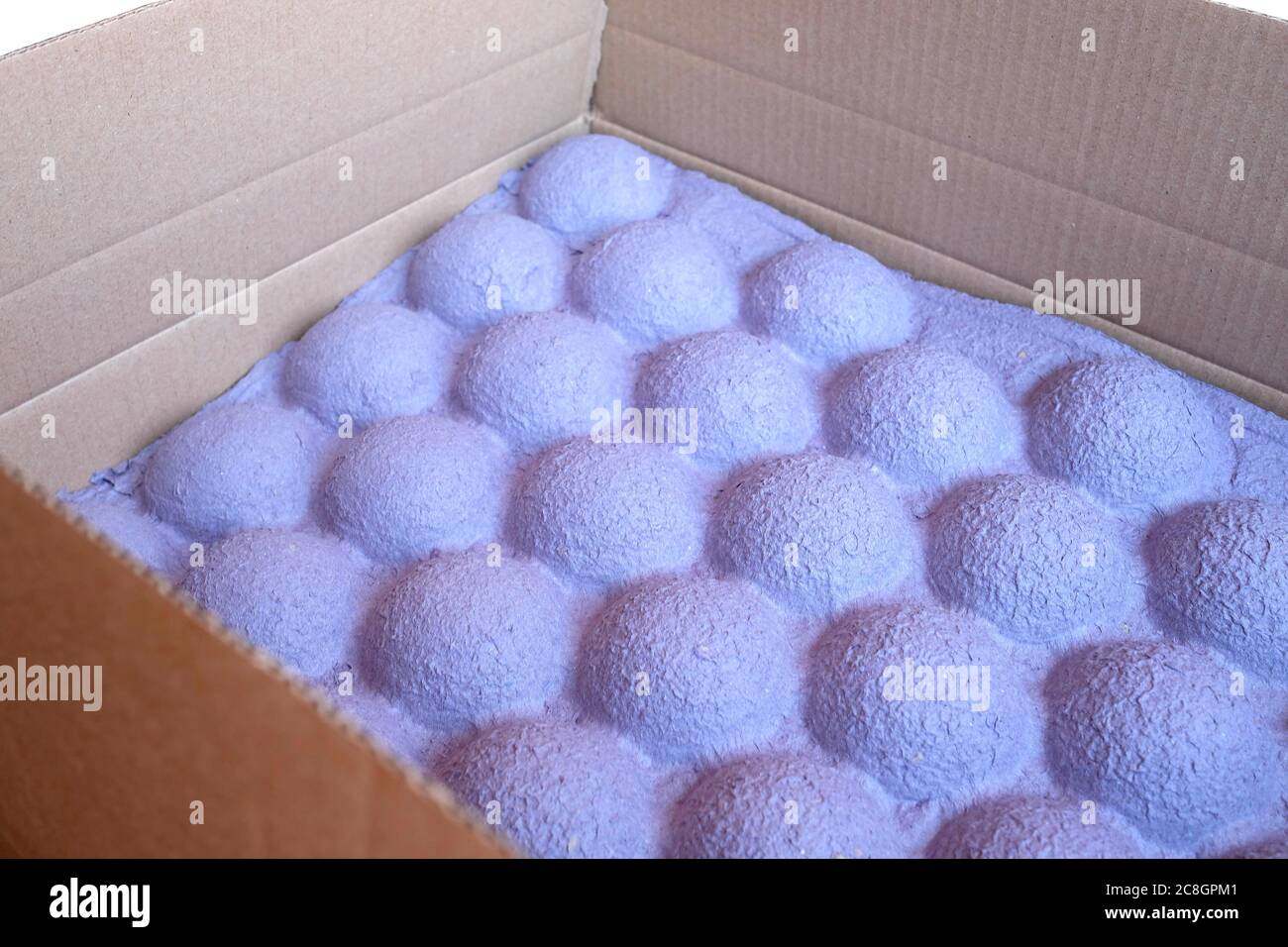 Unusual paper packaging for the transport of goods. Thick purple ...