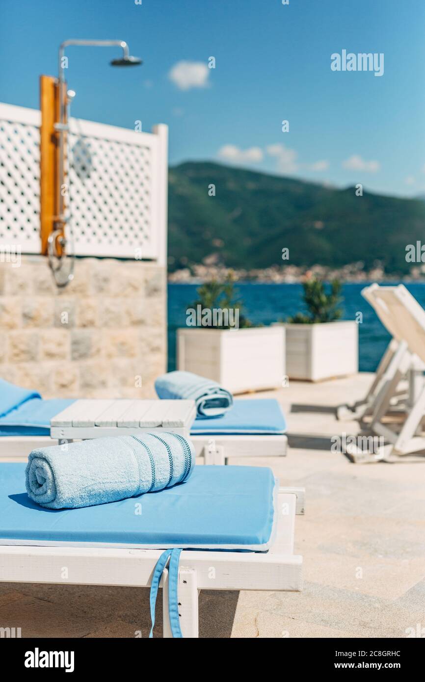 Blue beach towel on sun loungers on the beach near the sea Stock Photo ...