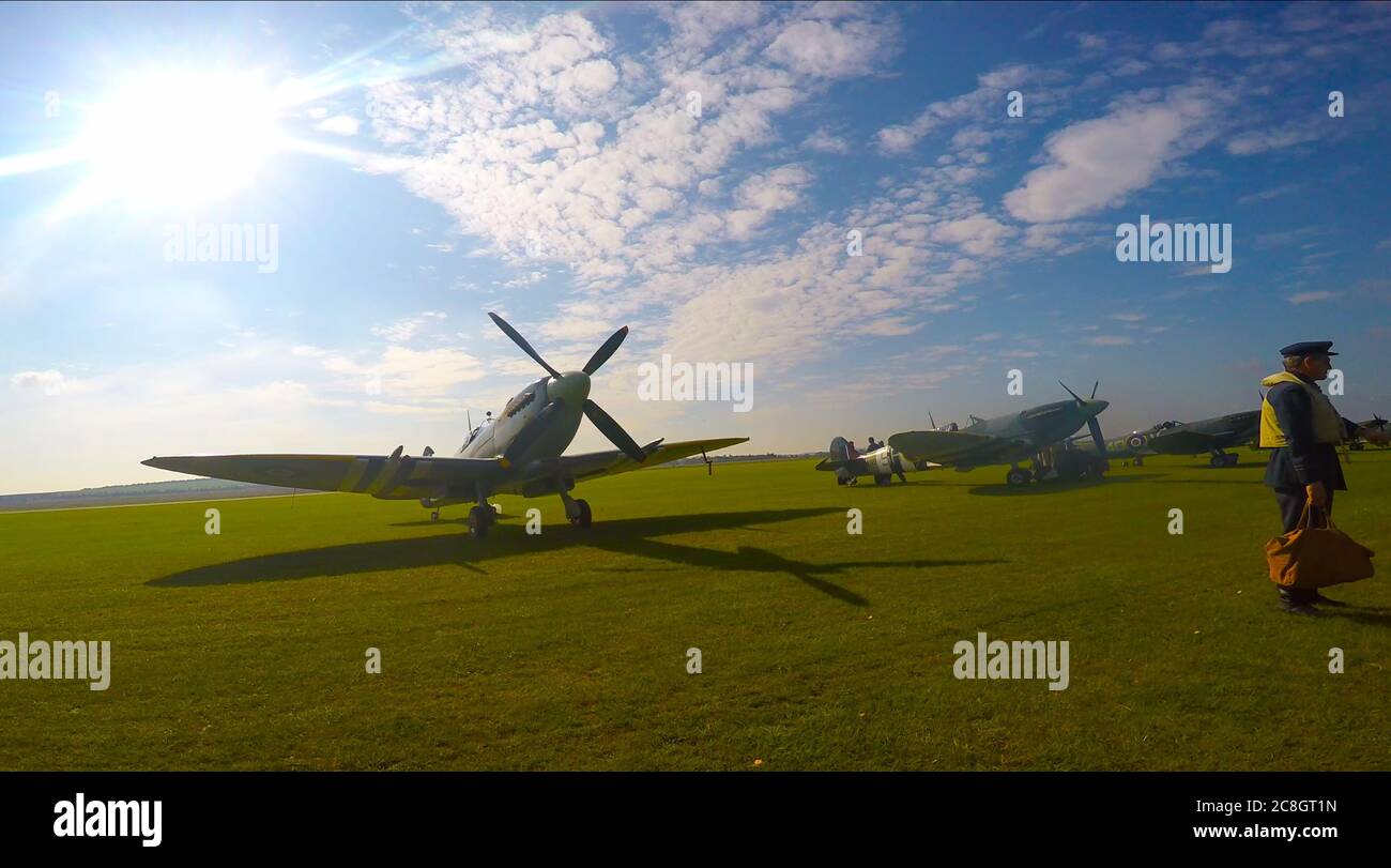 RAF fighter aircraft from the Battle of Britain era park at an airfield ...