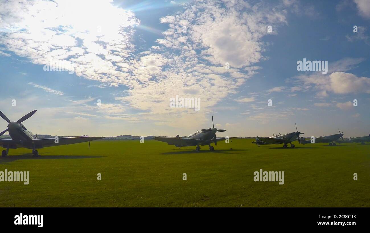 RAF fighter aircraft from the Battle of Britain era park at an airfield ...